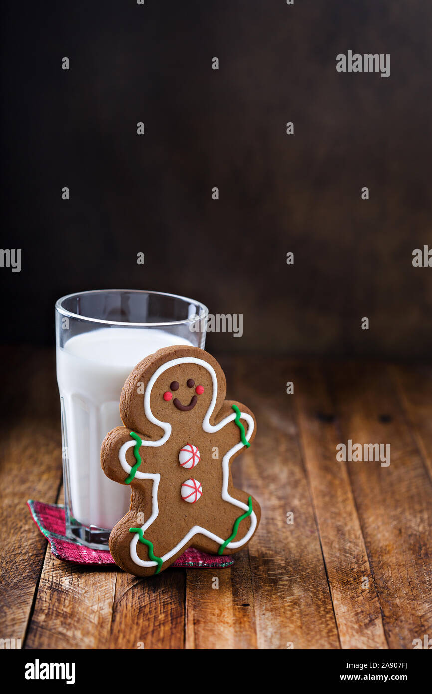 Christmas celebration with milk and gingerbread man cookie hi-res stock ...