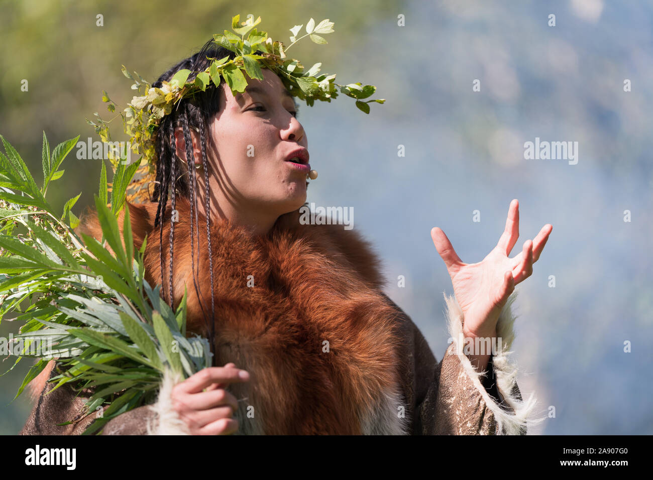 Expression young woman in clothing aboriginal of Kamchatka Peninsula ...