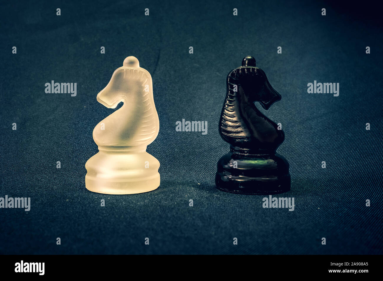 Opposing Knights face there differences face to face Stock Photo - Alamy