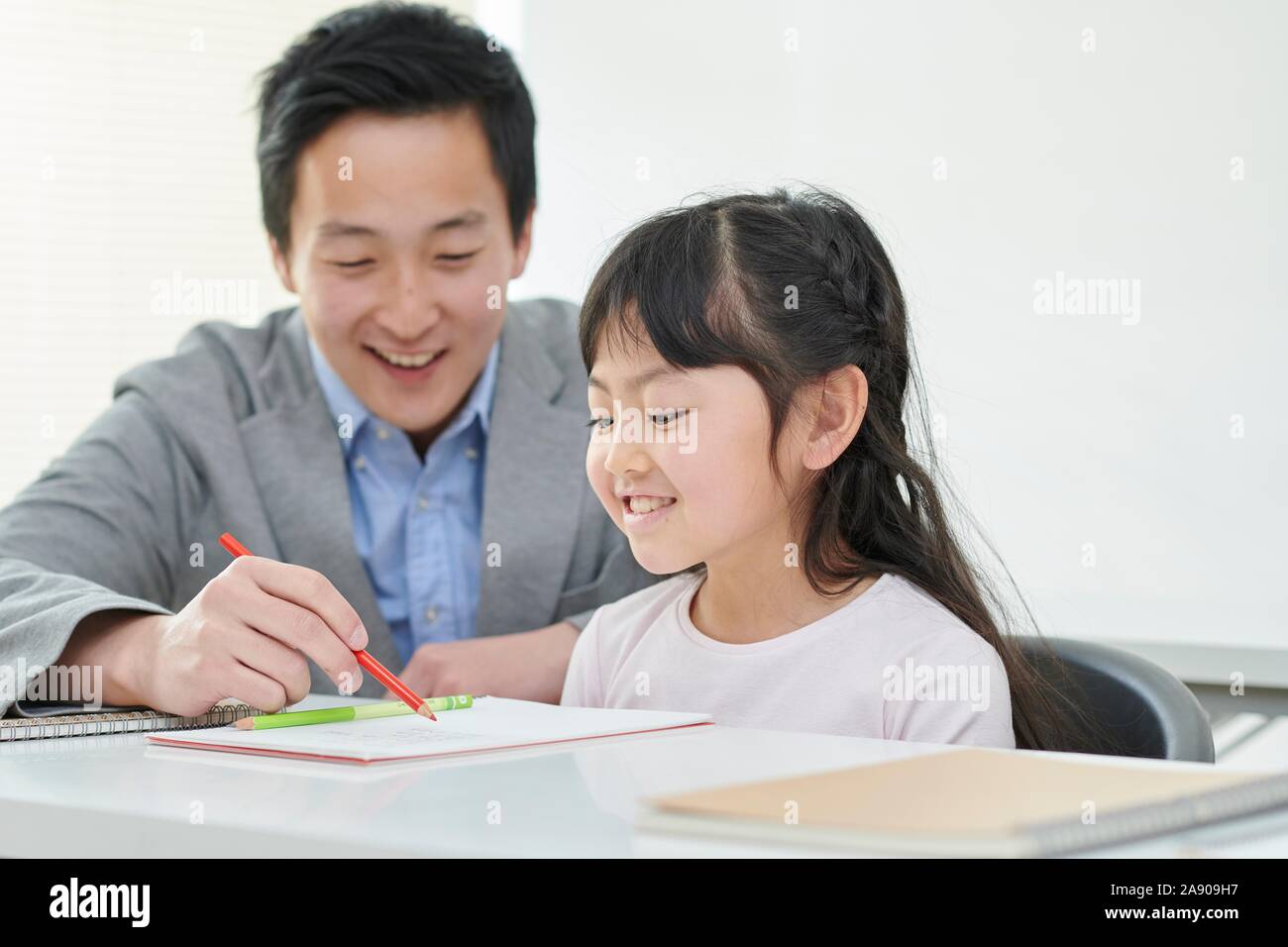 Japanese elementary school kid with teacher Stock Photo - Alamy