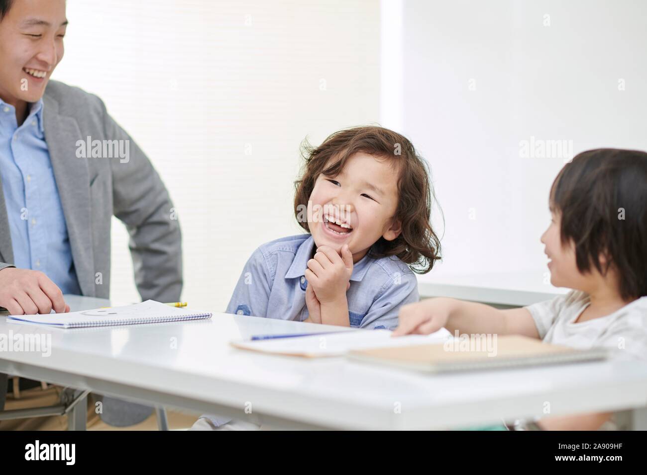 Japanese elementary school kids with teacher Stock Photo - Alamy