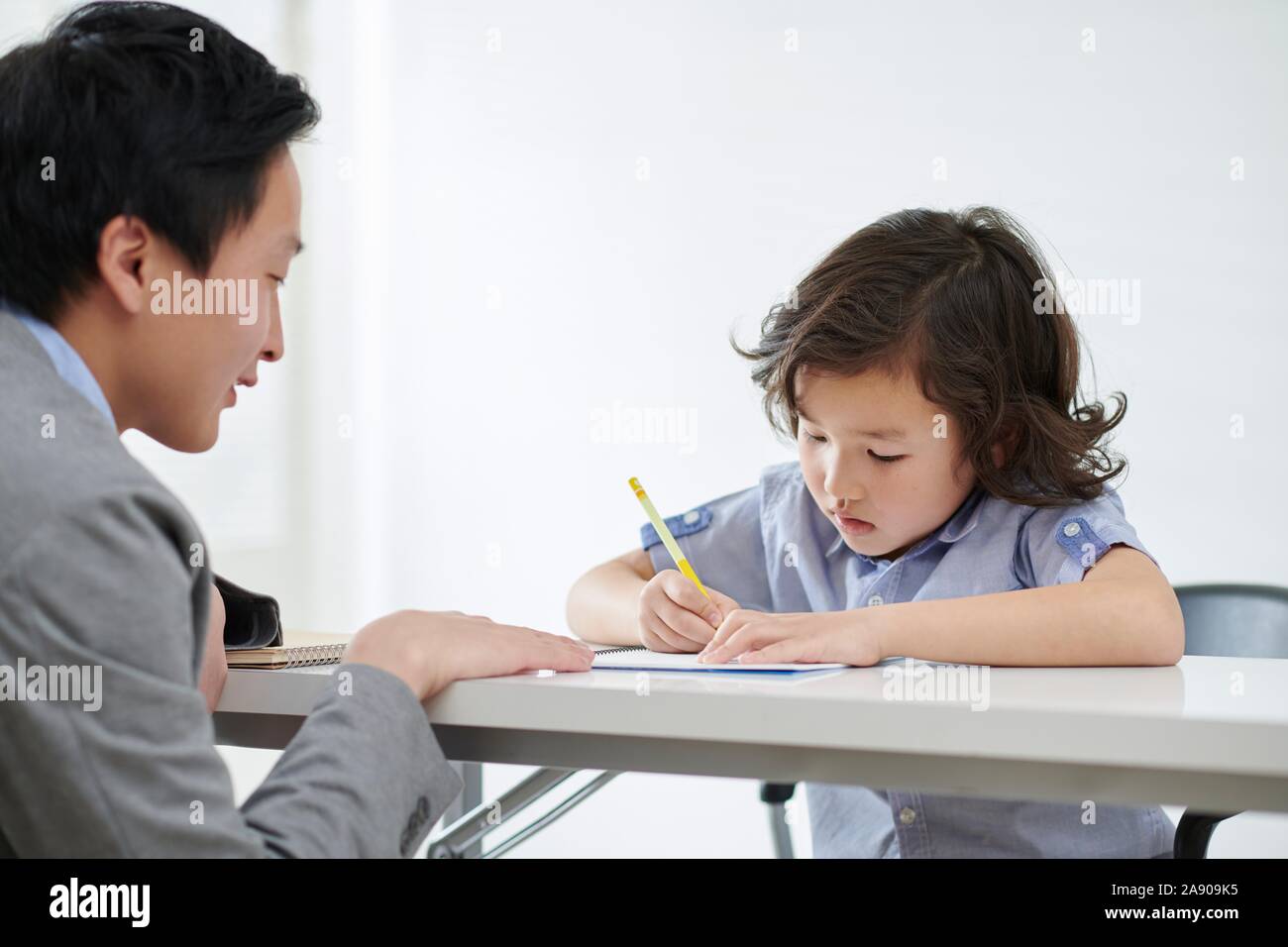 Japanese elementary school kid with teacher Stock Photo - Alamy