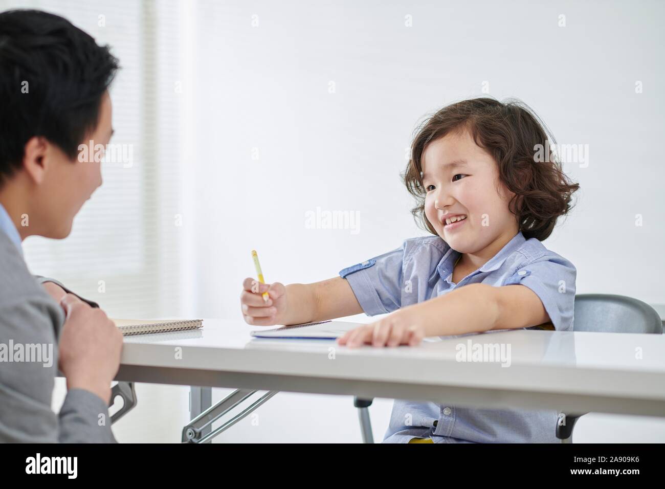 Japanese elementary school kid with teacher Stock Photo - Alamy