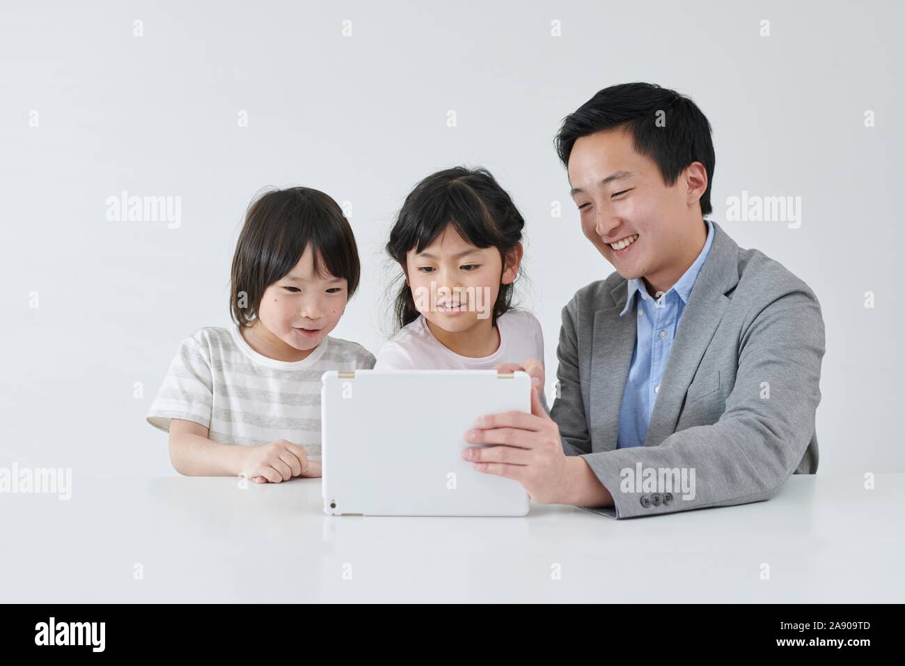 Japanese elementary school kids with teacher Stock Photo - Alamy