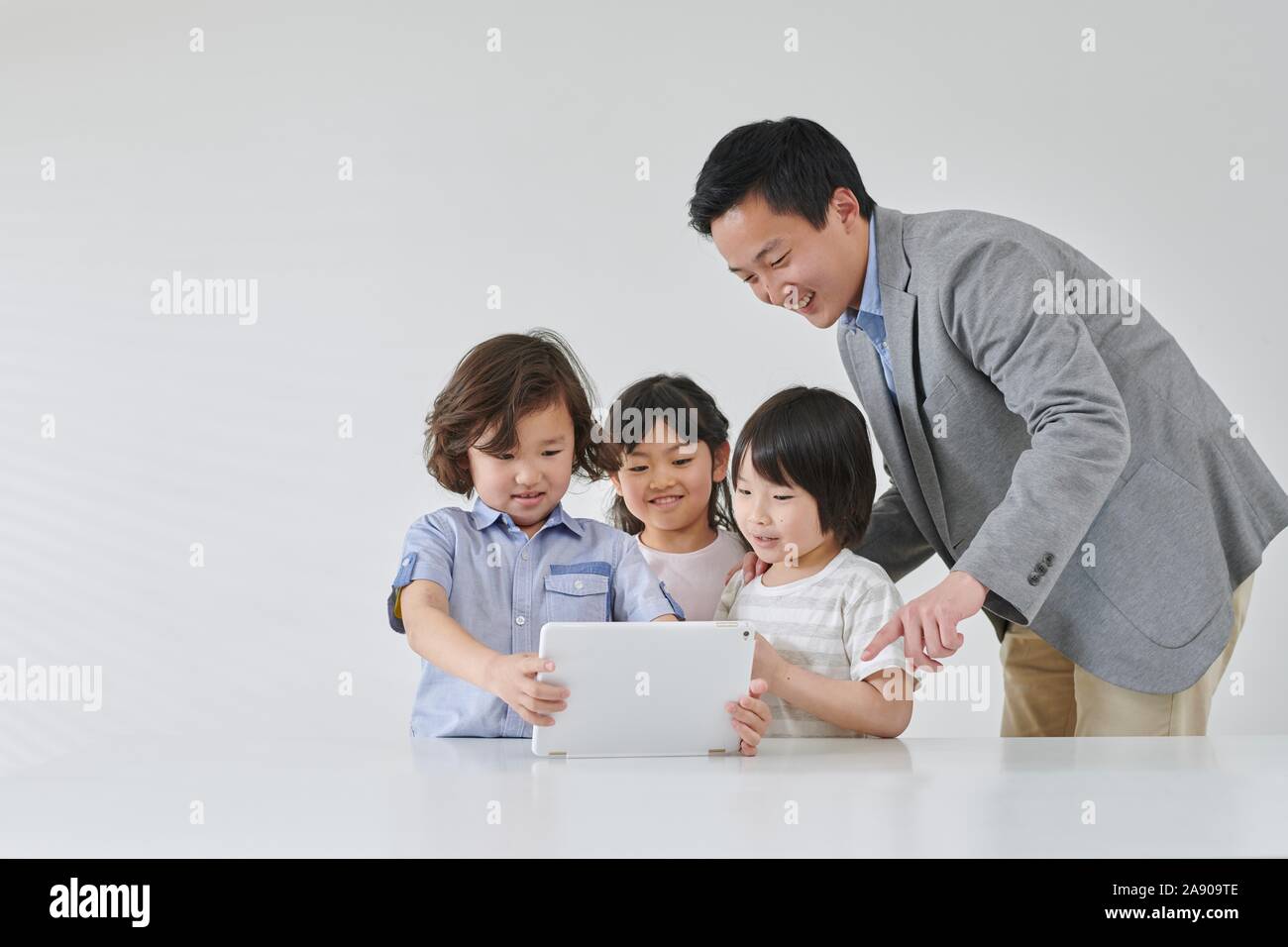 Japanese elementary school kids with teacher Stock Photo - Alamy