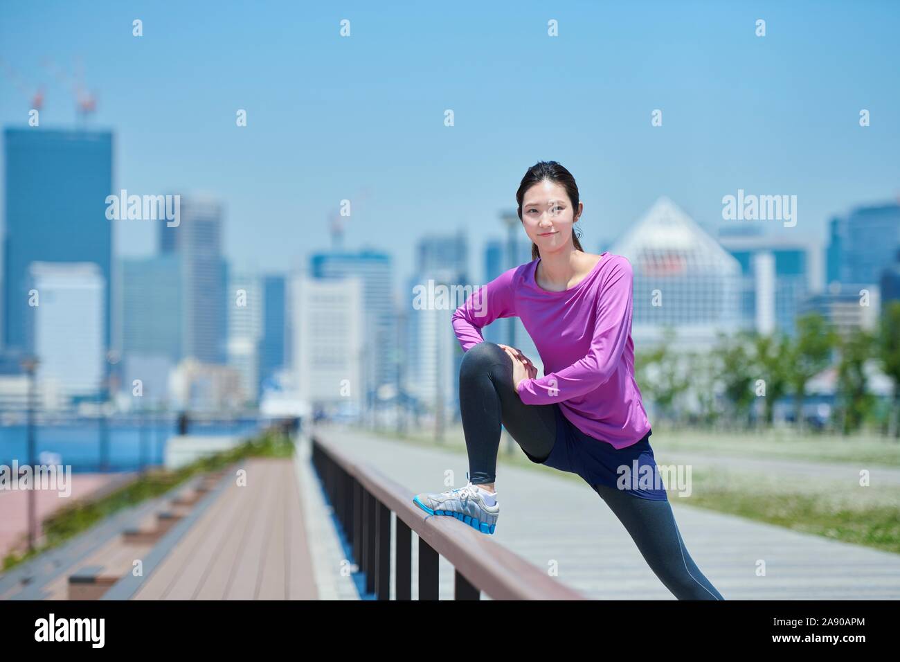 Young Japanese woman running downtown Tokyo Stock Photo - Alamy