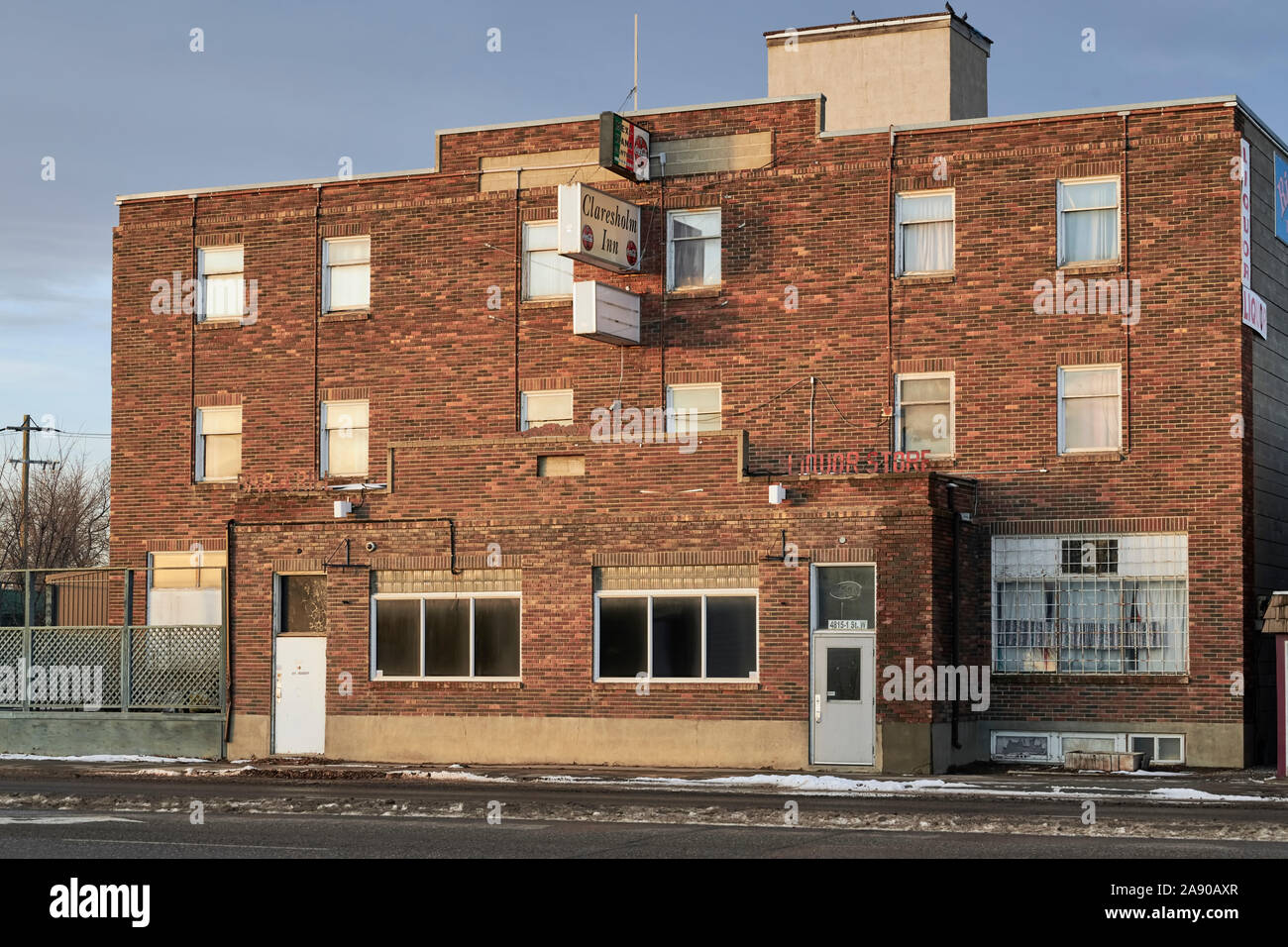 An old brick exterior hotel and bar on the main highway in a small town ...