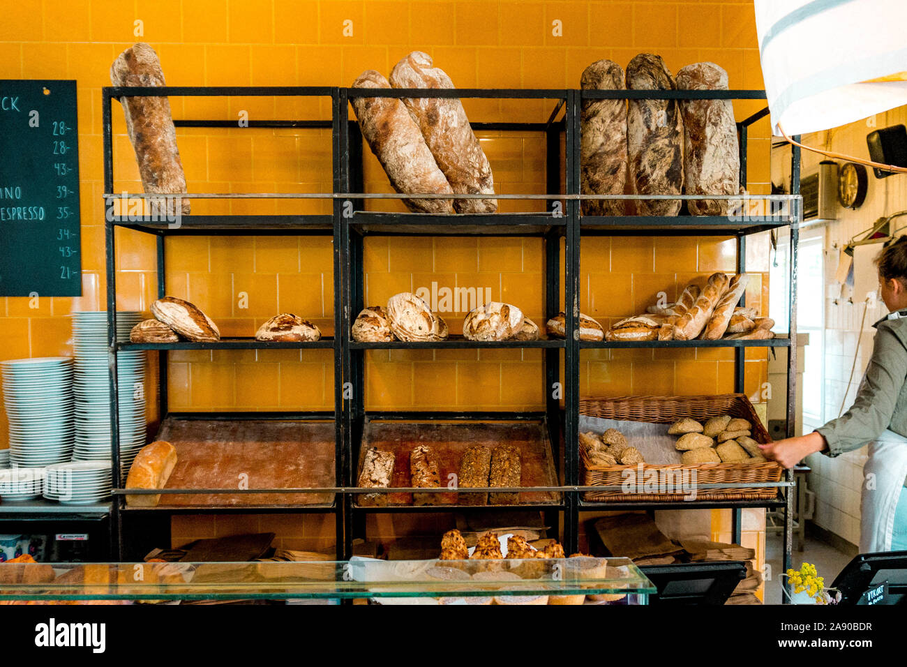 Deli shop counter bread man hi-res stock photography and images - Alamy