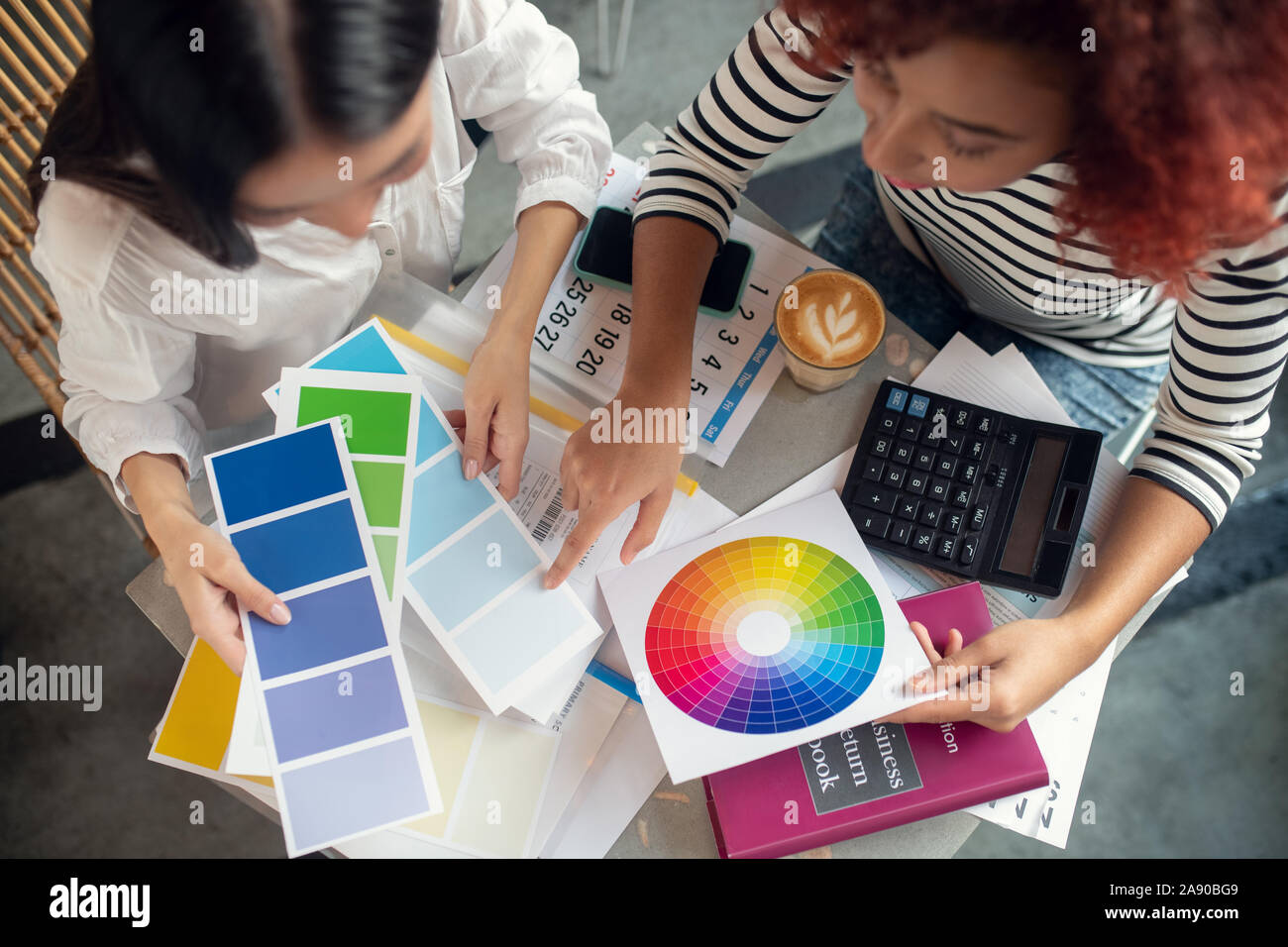 Top view of designers looking at color palette Stock Photo - Alamy