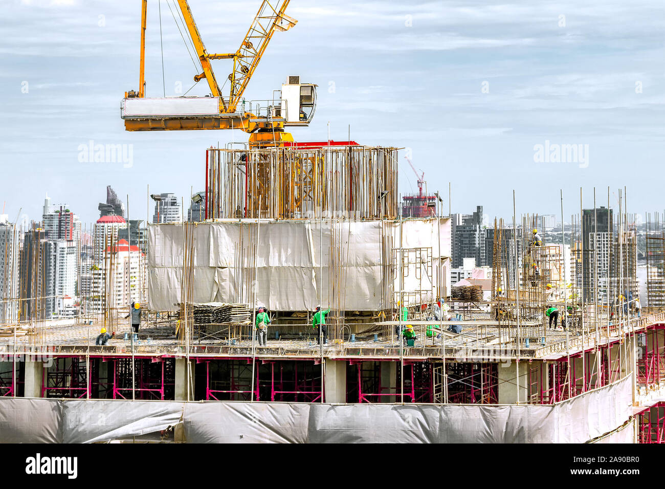 Aerial view of a building construction with tower crane, scaffolding ...