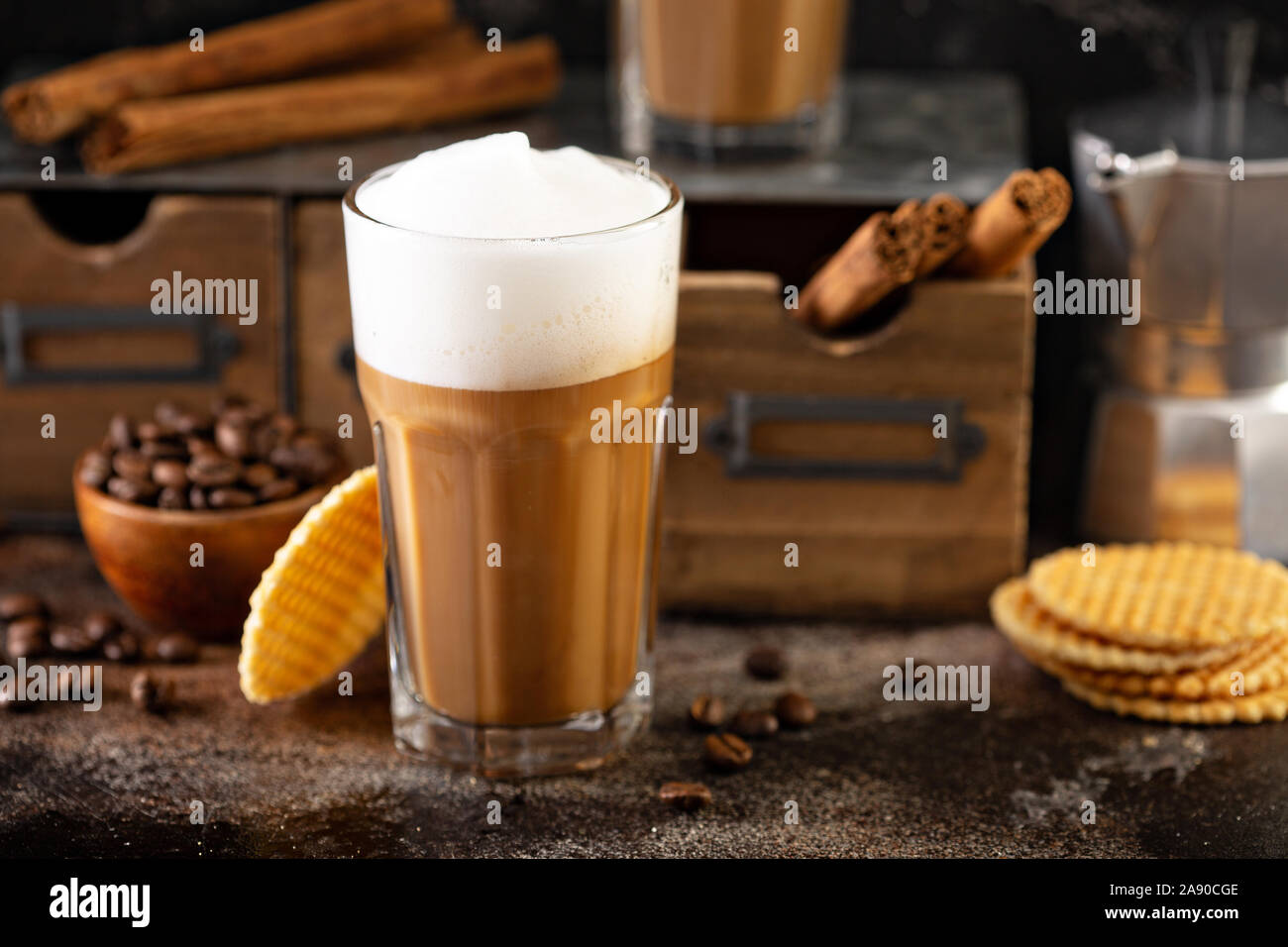 Coffee latte with thin crisp waffles on dark background Stock Photo - Alamy