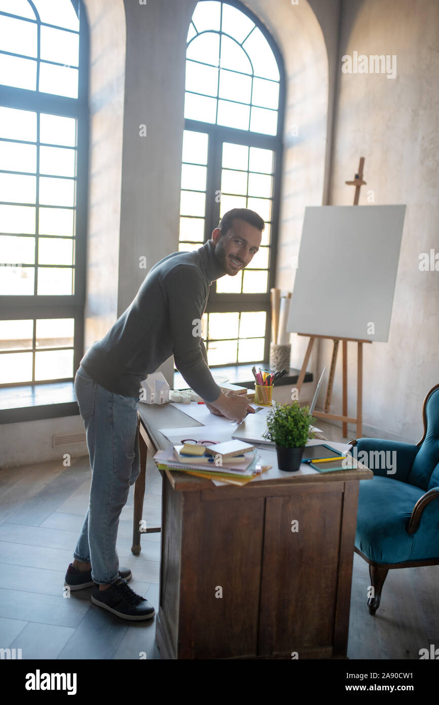 Interior designer feeling inspired and motivated Stock Photo - Alamy