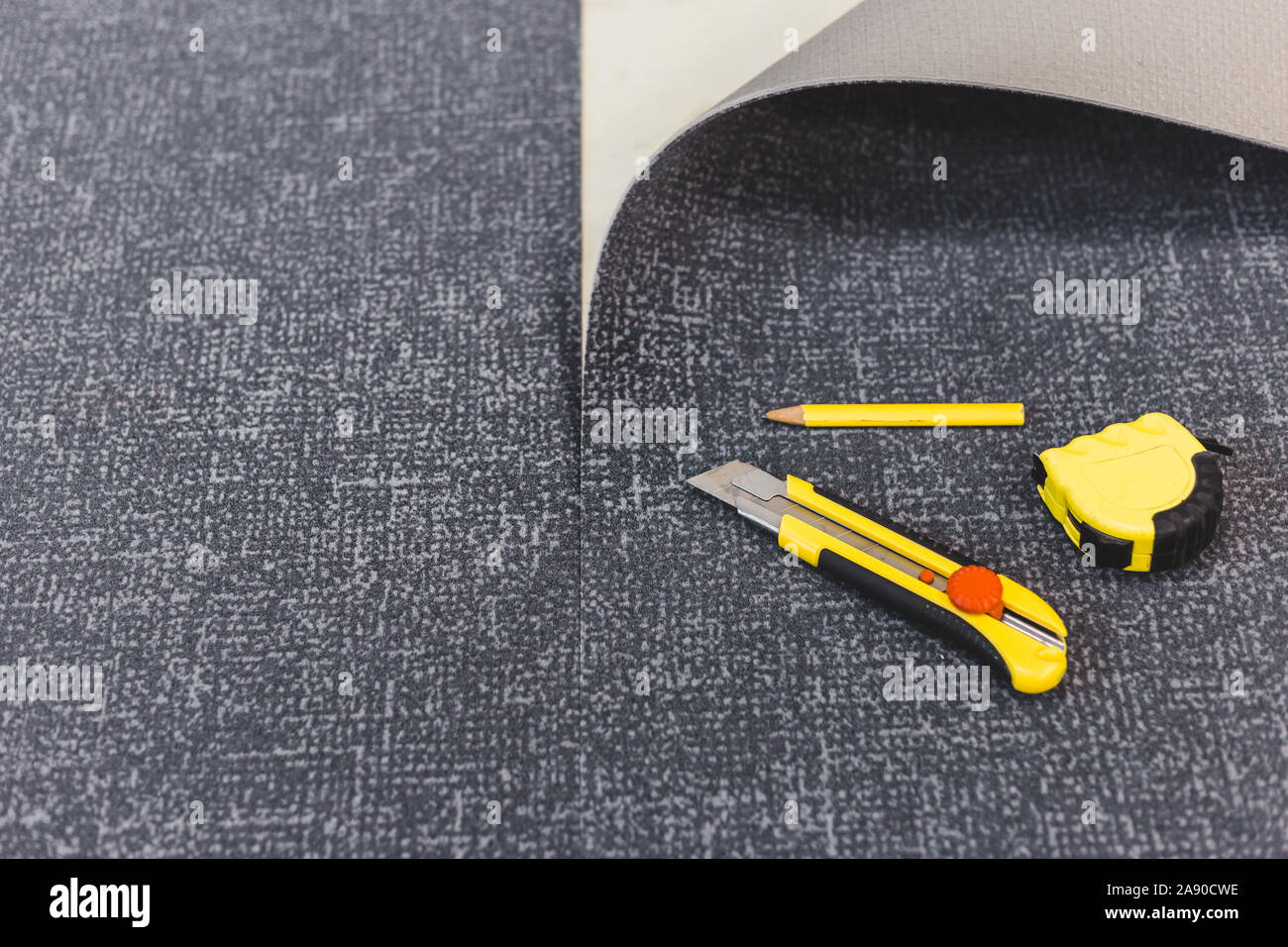 Work tools for laying carpet - tape measure, knife and pencil - laying ...