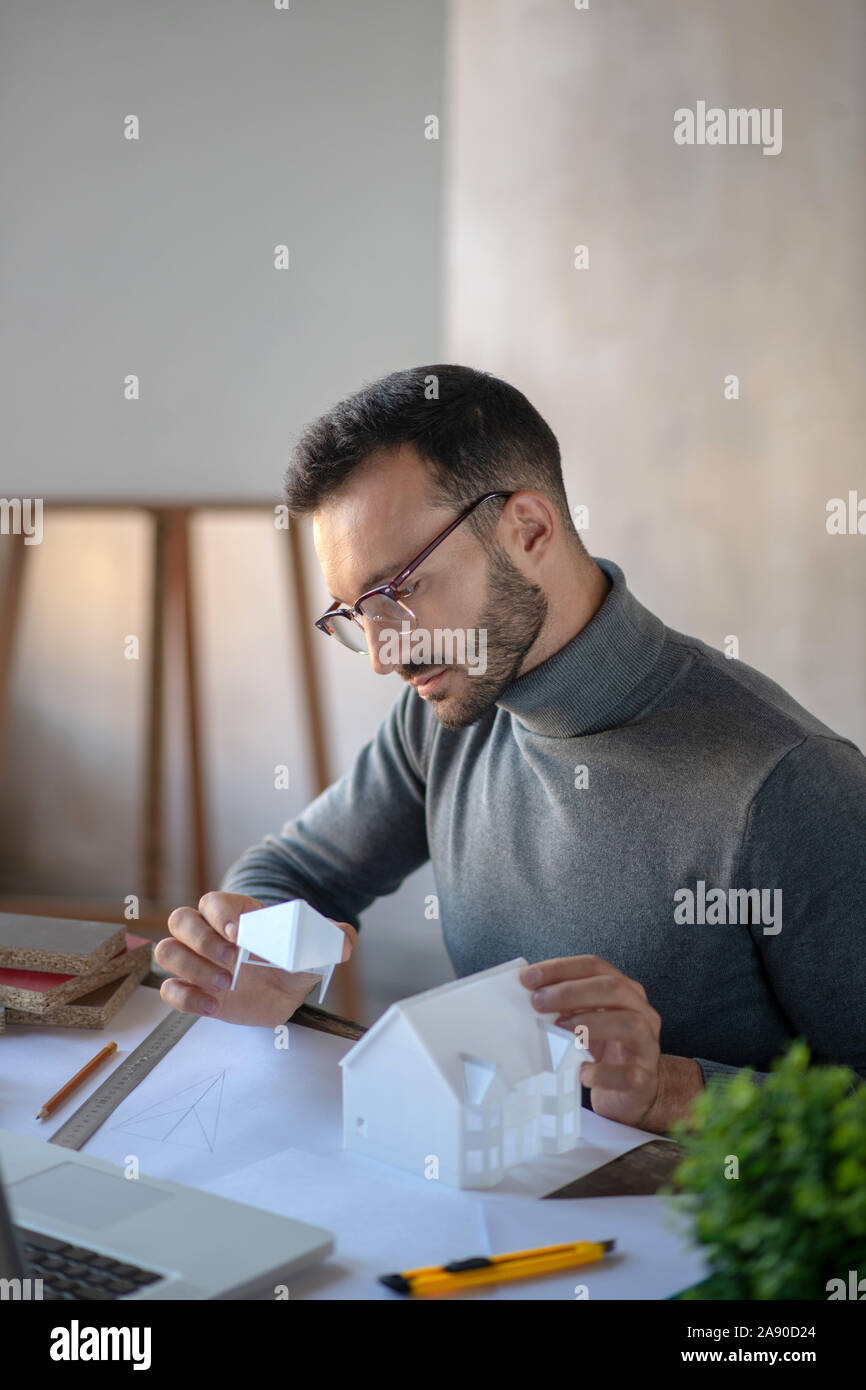 Serious interior designer feeling involved in planning project Stock ...