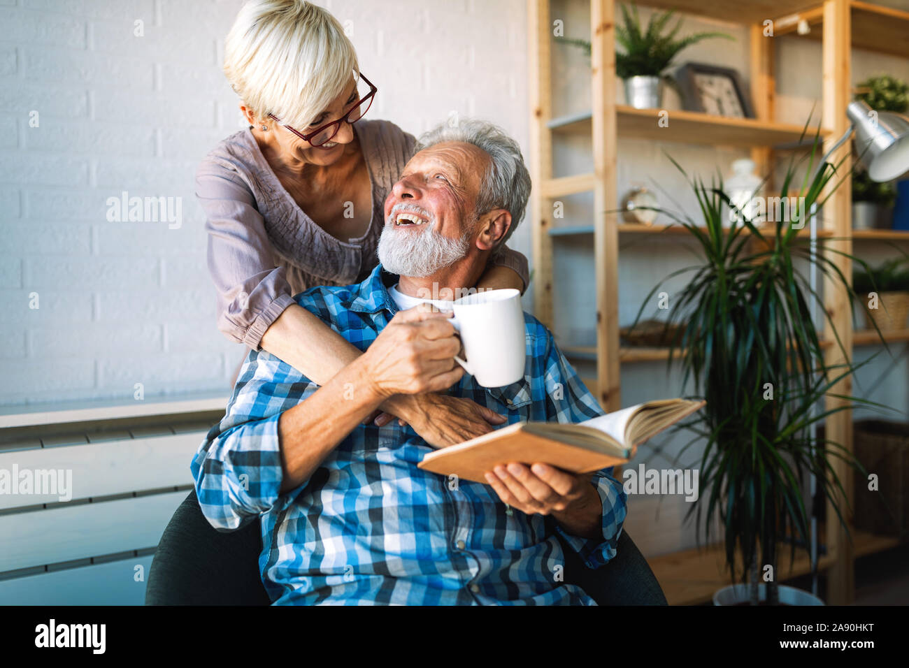 Happy senior couple in love hugging and bonding with true emotions at ...
