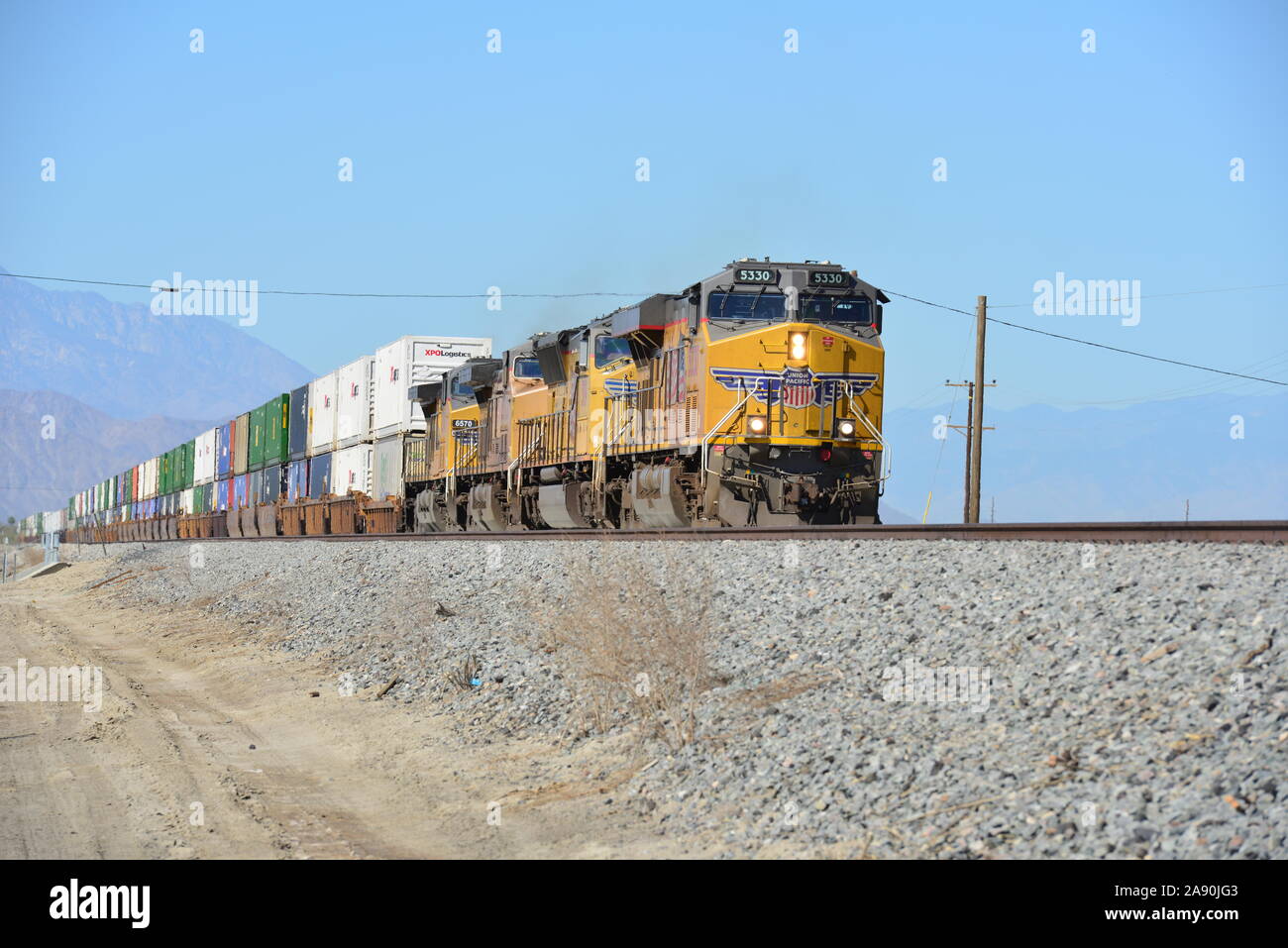 General Electric ET44AH locomotive pulling a freight train Stock Photo ...