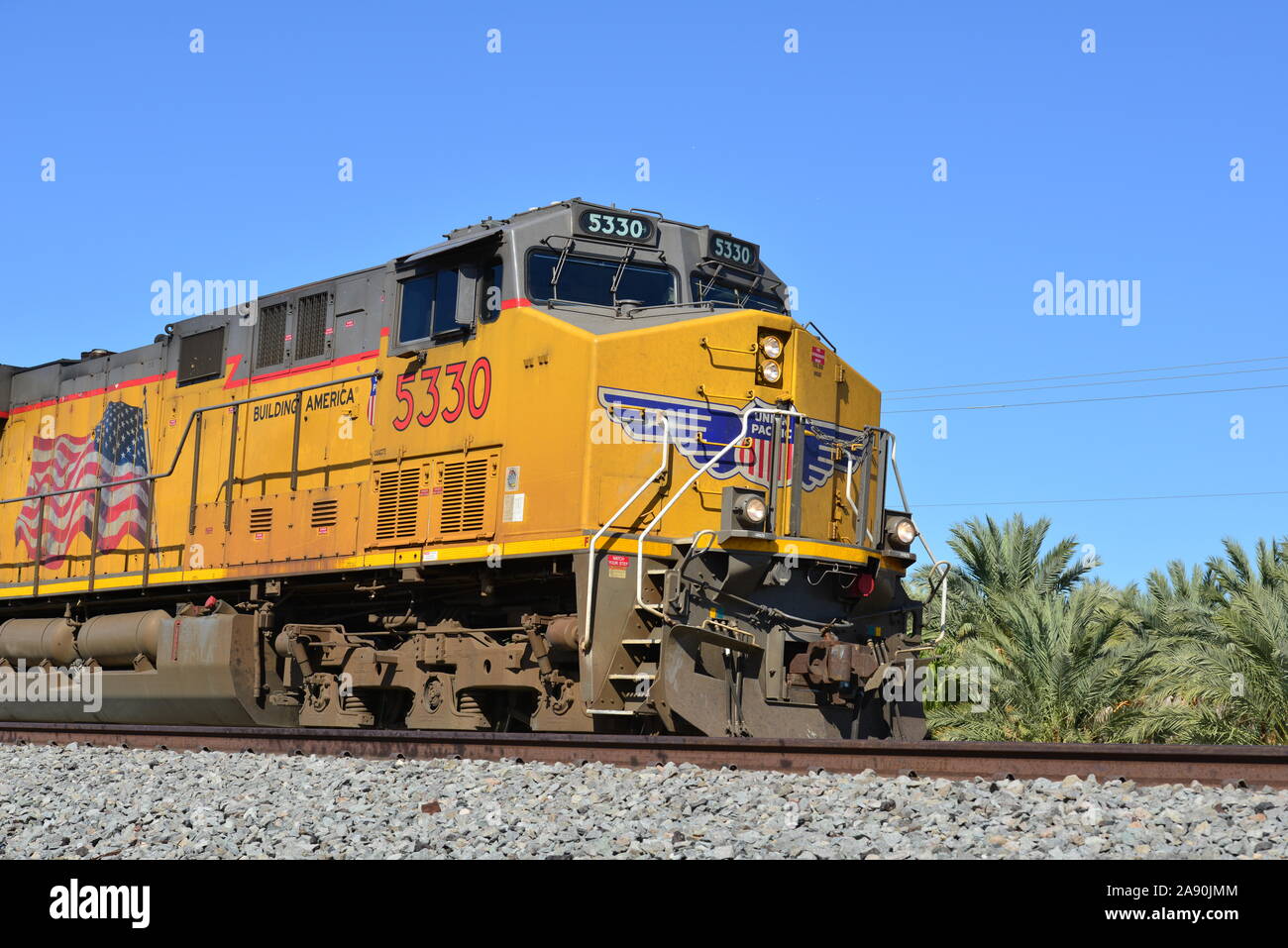 General Electric ET44AH locomotive pulling a freight train Stock Photo ...