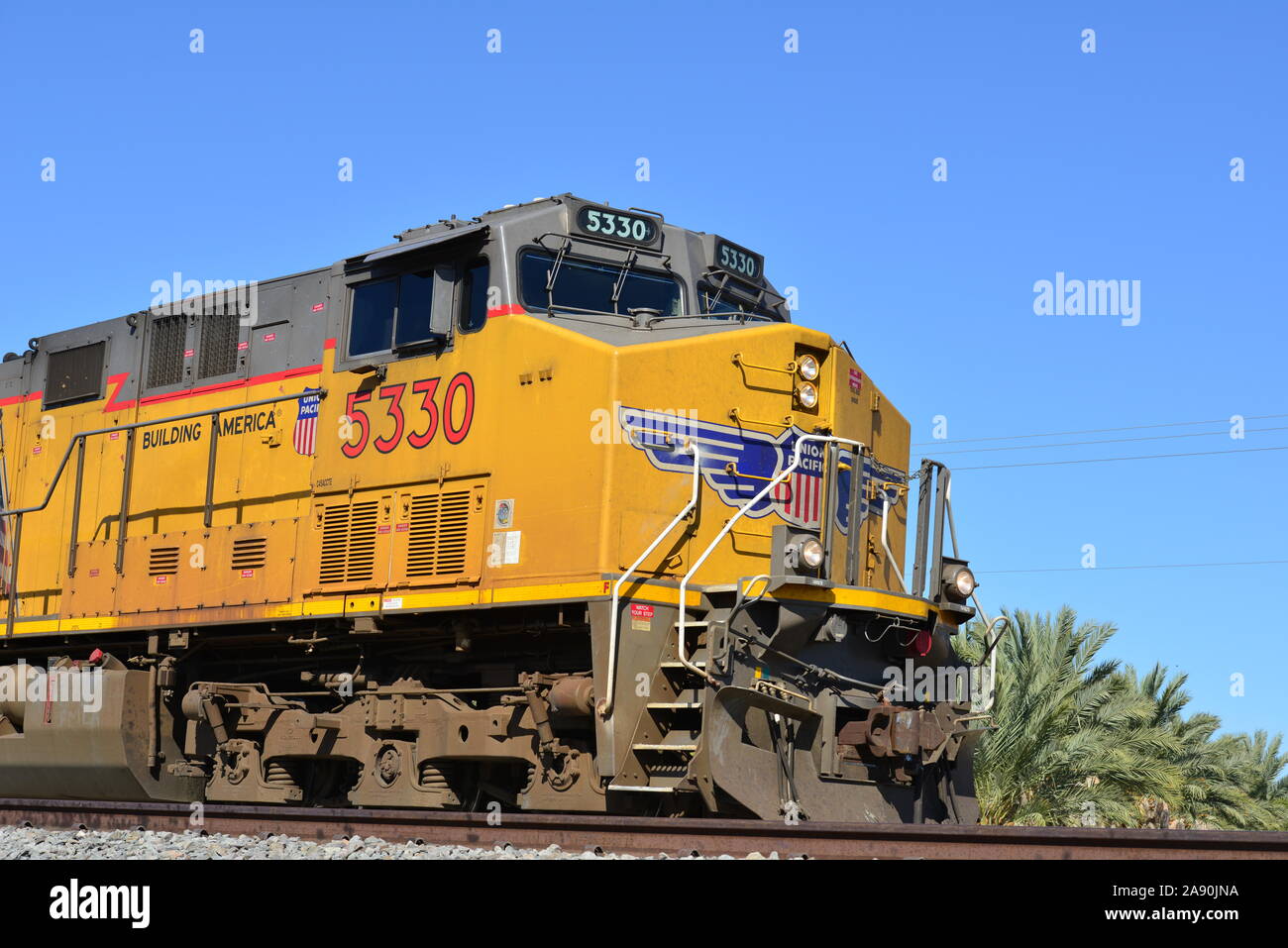 General Electric ET44AH locomotive pulling a freight train Stock Photo ...
