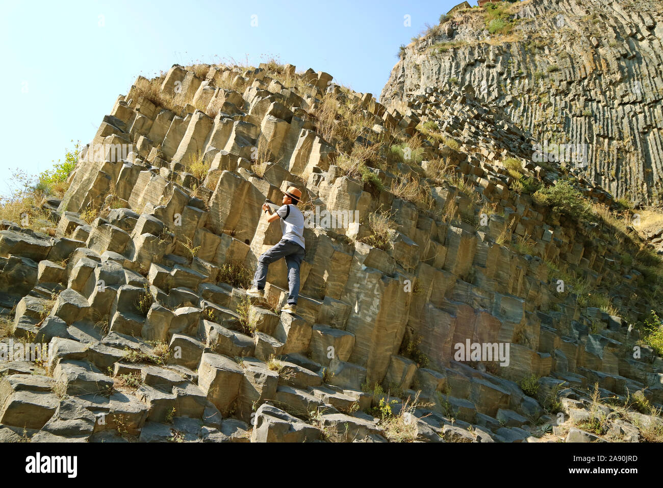 Man Climbing the Symphony of Stones, Massive Basalt Column Formations ...