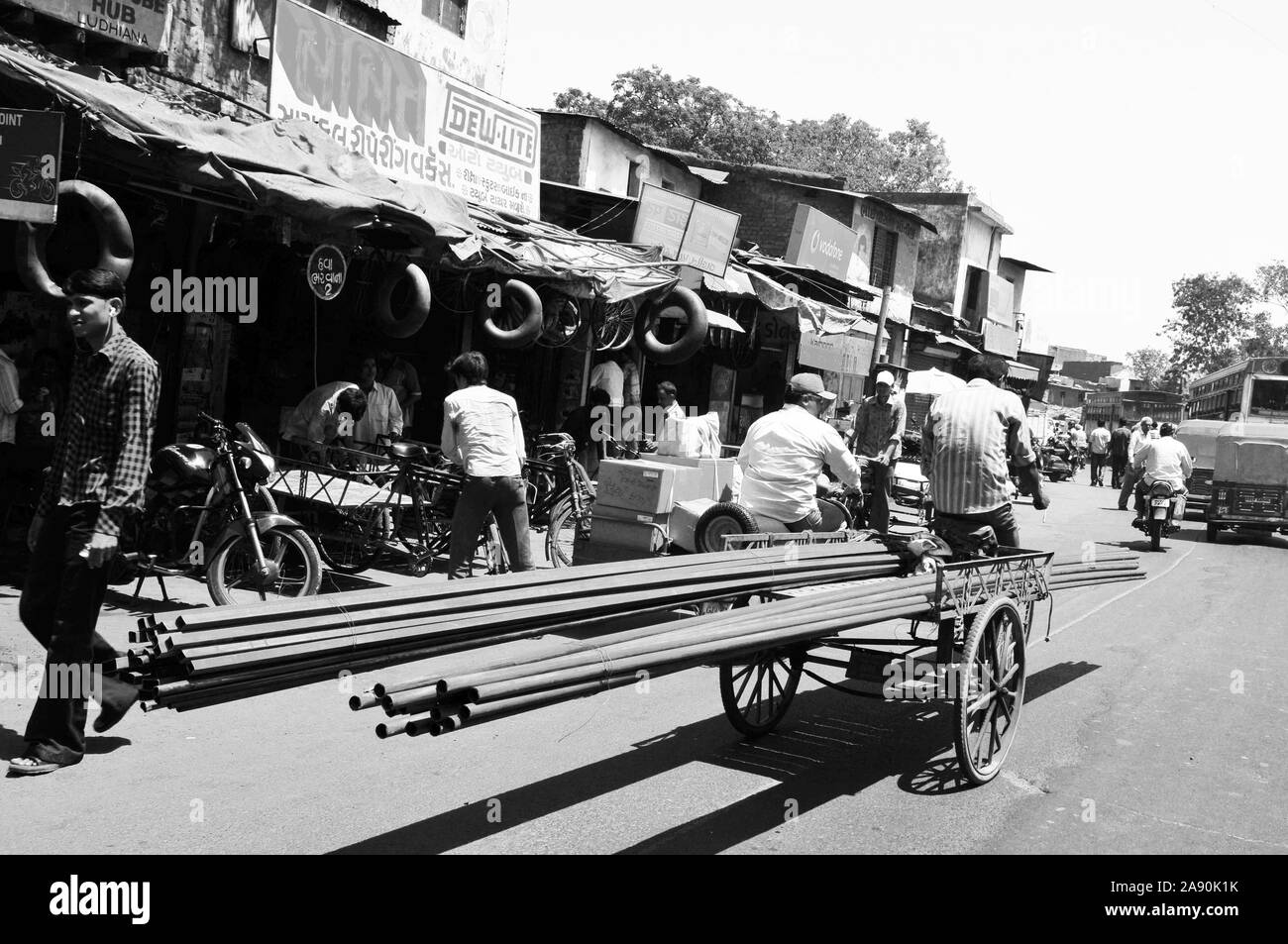 Iron-transport, carried on a bicycle through the streets of Ahmedabad ...