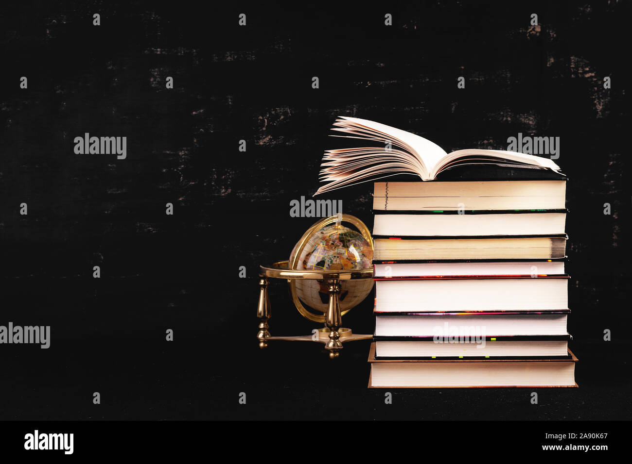 Stack of different books on dark background. Knowledge concept Stock ...