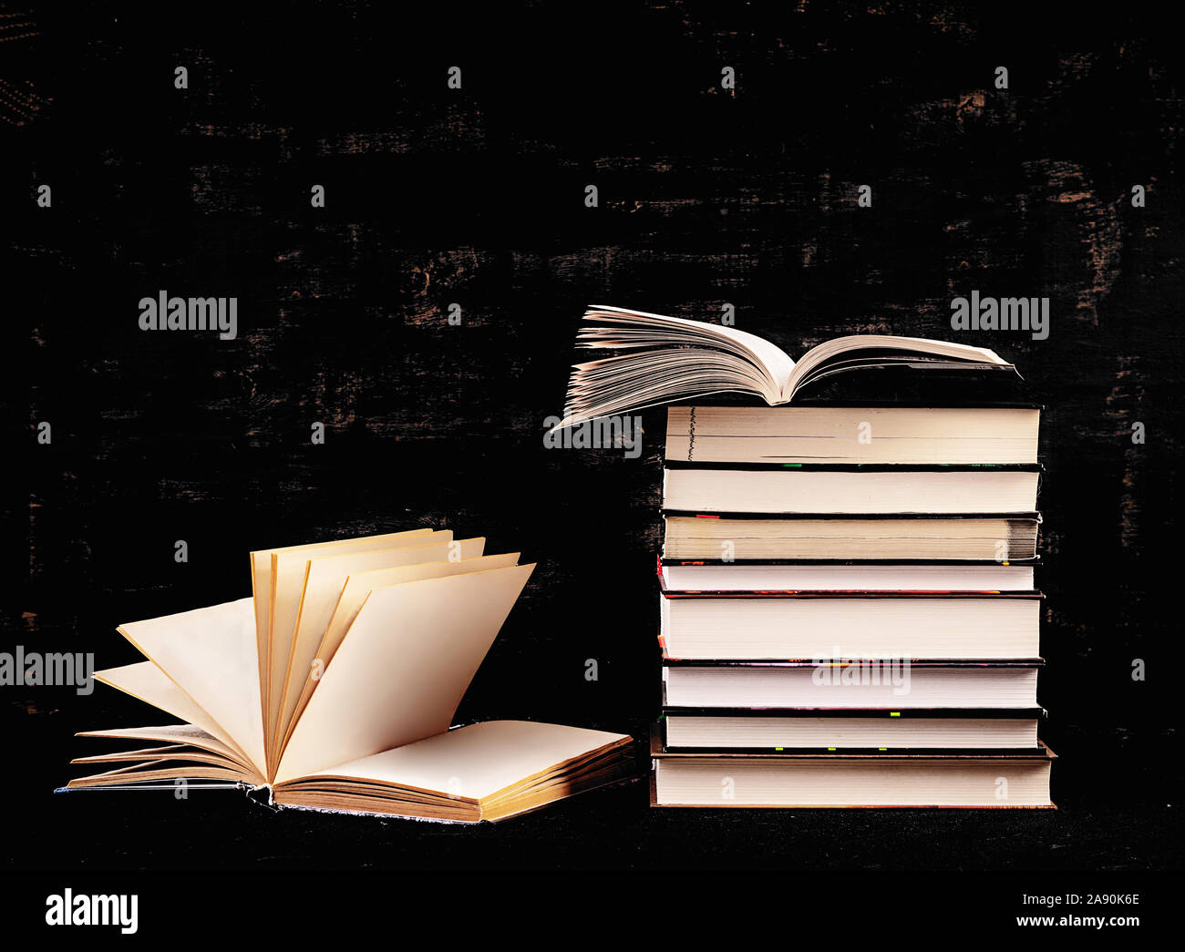 Stack of different books on dark background. Knowledge concept Stock ...