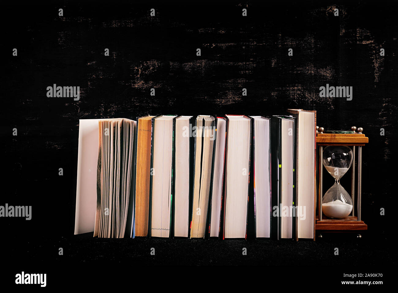 Stack of different books on dark background. Knowledge concept Stock ...