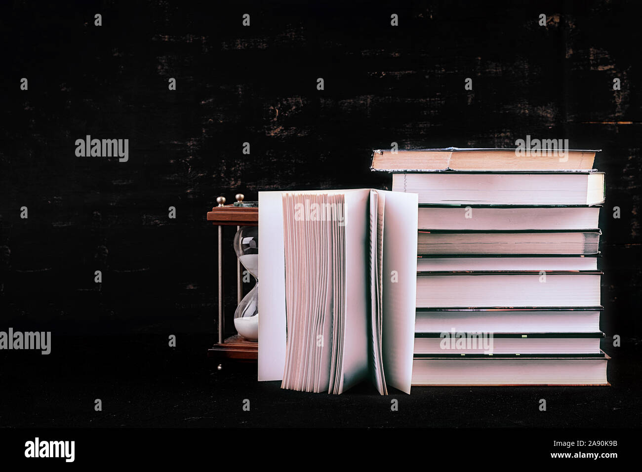 Stack of different books on dark background. Knowledge concept Stock ...