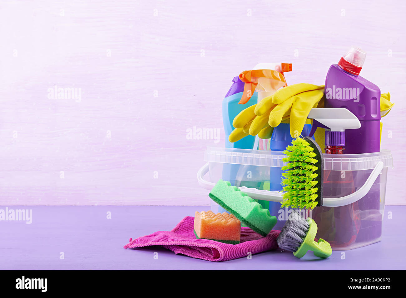 Cleaning service concept. Colorful cleaning set for different surfaces ...