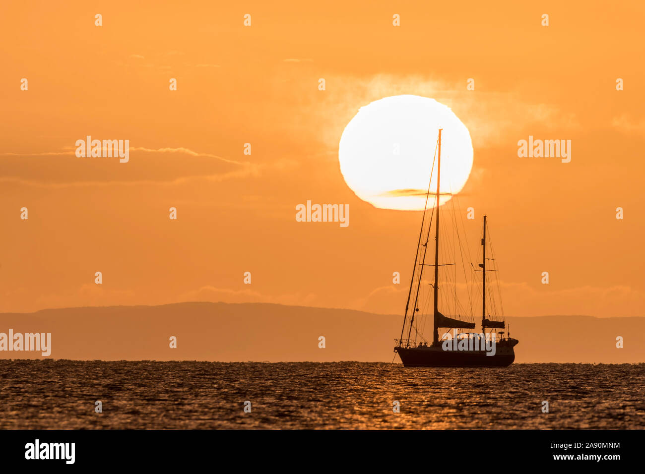 Sailing ride on the sea during sunrise Stock Photo - Alamy