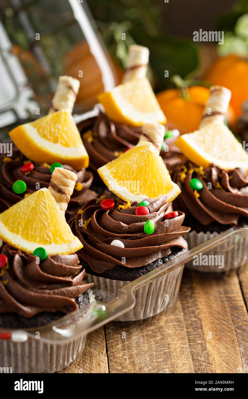 Chocolate orange cupcakes for Christmas with decorations and twinkle ...
