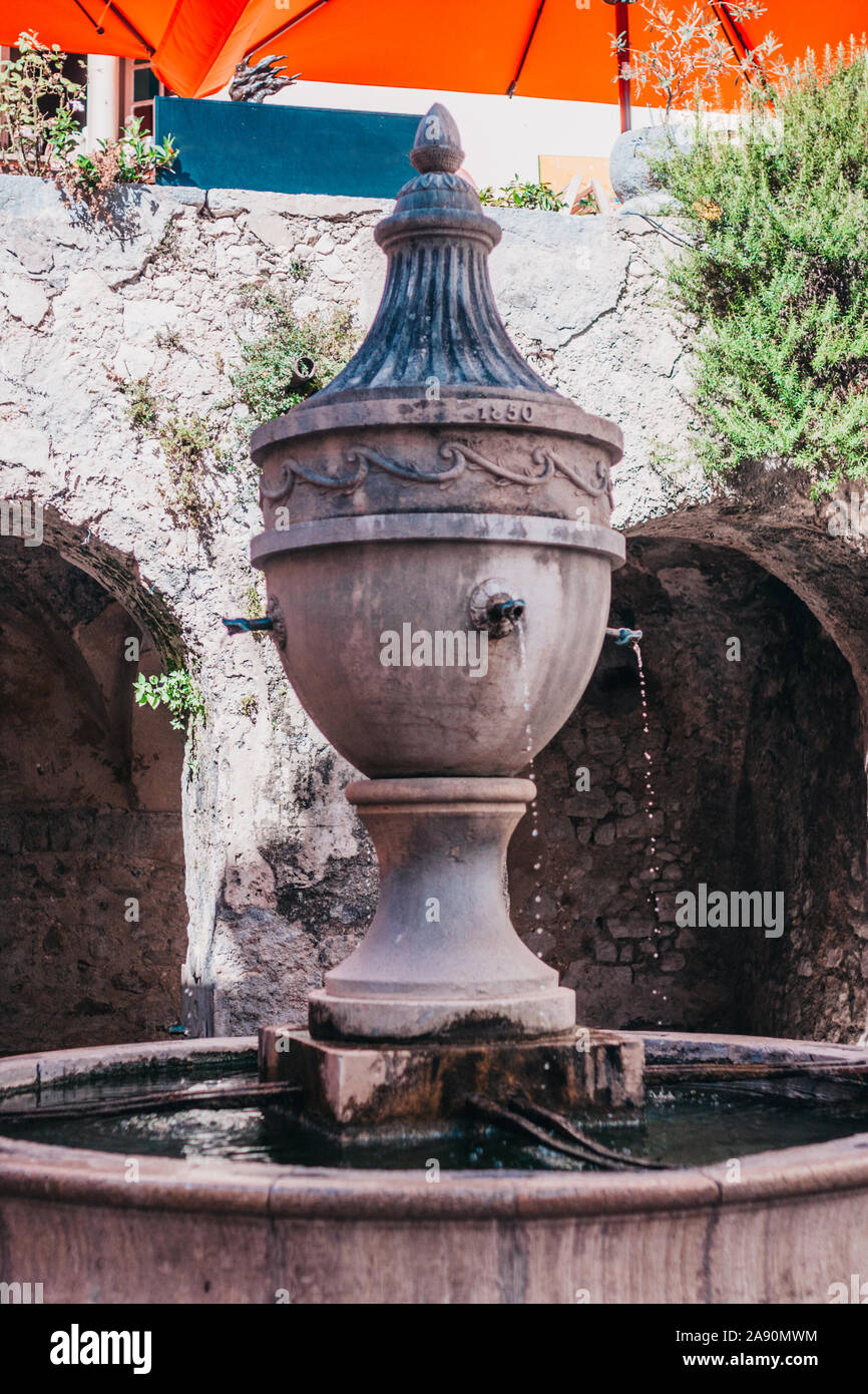 Source of fresh drinking water in narrow medieval streets Stock Photo ...
