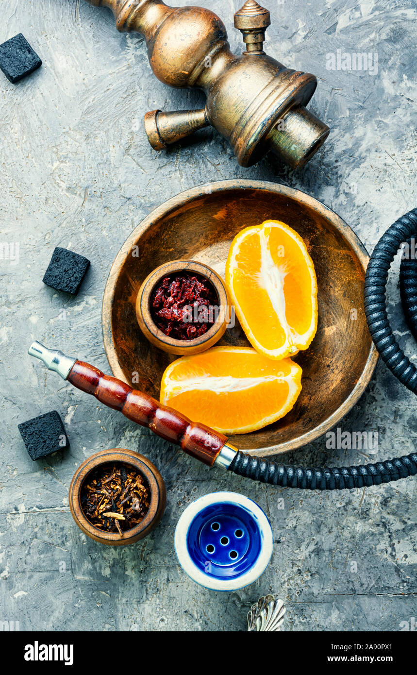 Smoking turkish shisha with orange.Details of Oriental hookah.Egyptian ...