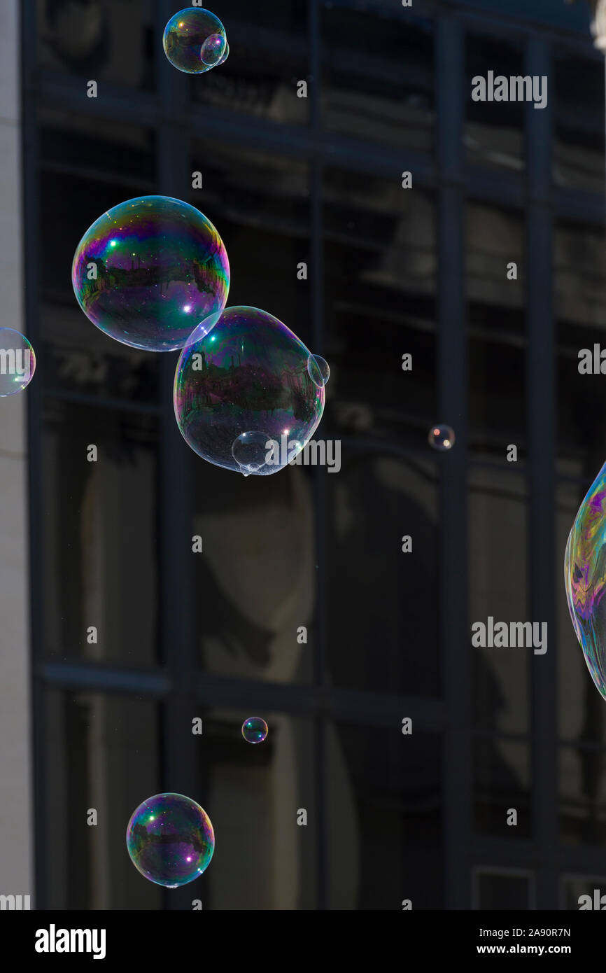 Bubbles created by a busker / street performer , in front of The ...