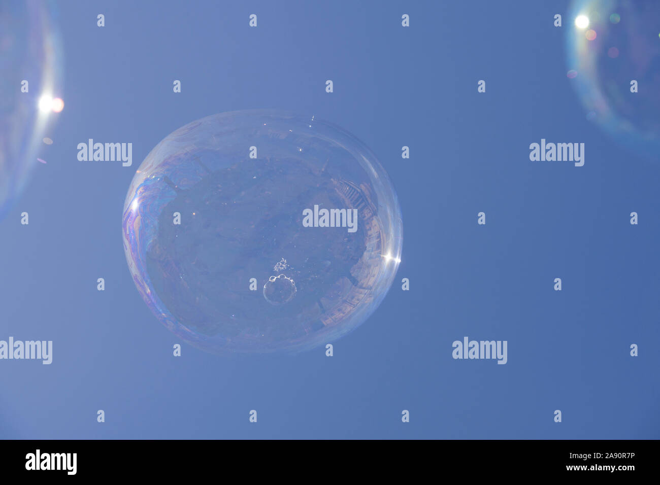 Bubbles created by a busker / street performer , in front of The ...