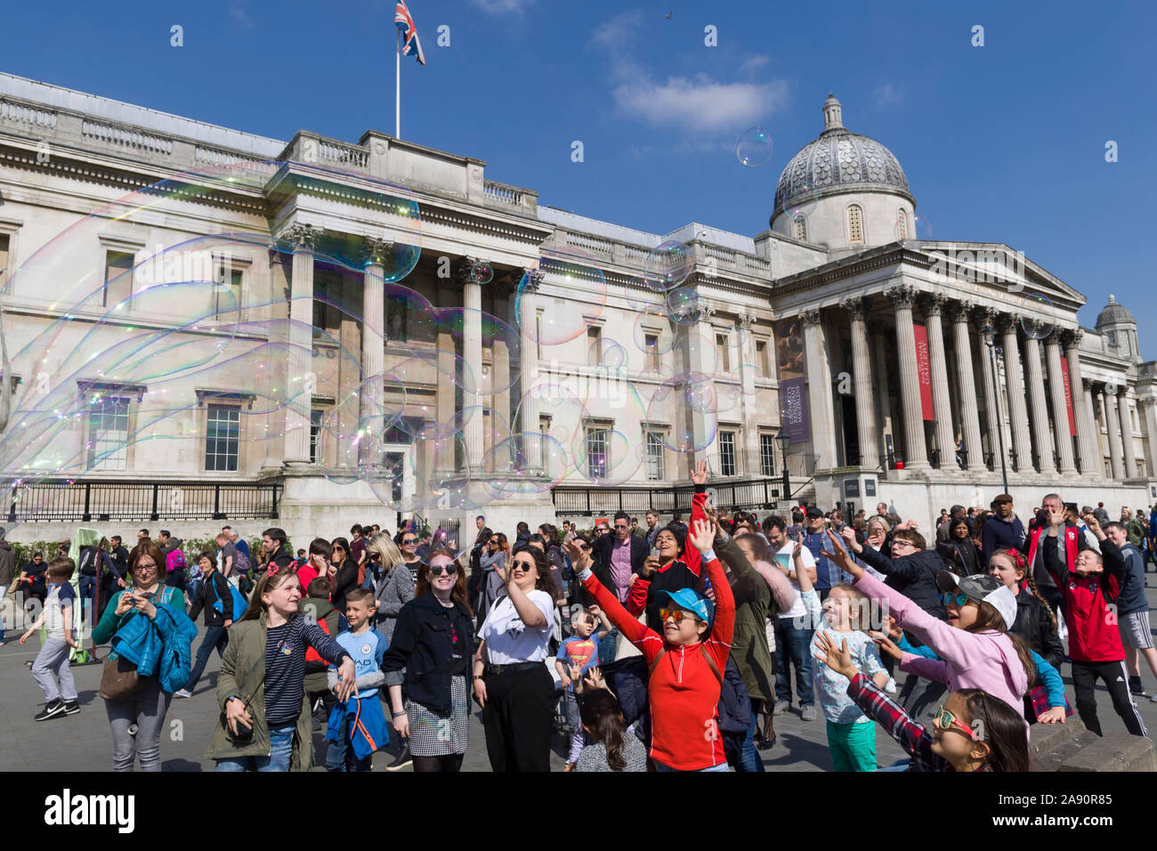 Bubbles created by a busker / street performer , in front of The ...