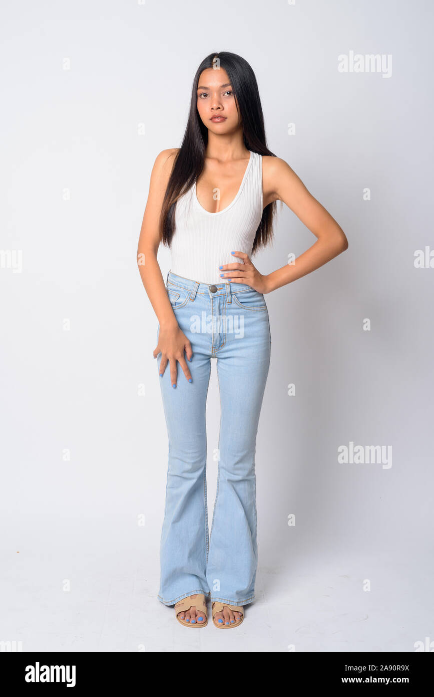 Full body shot of young beautiful Asian woman Stock Photo - Alamy