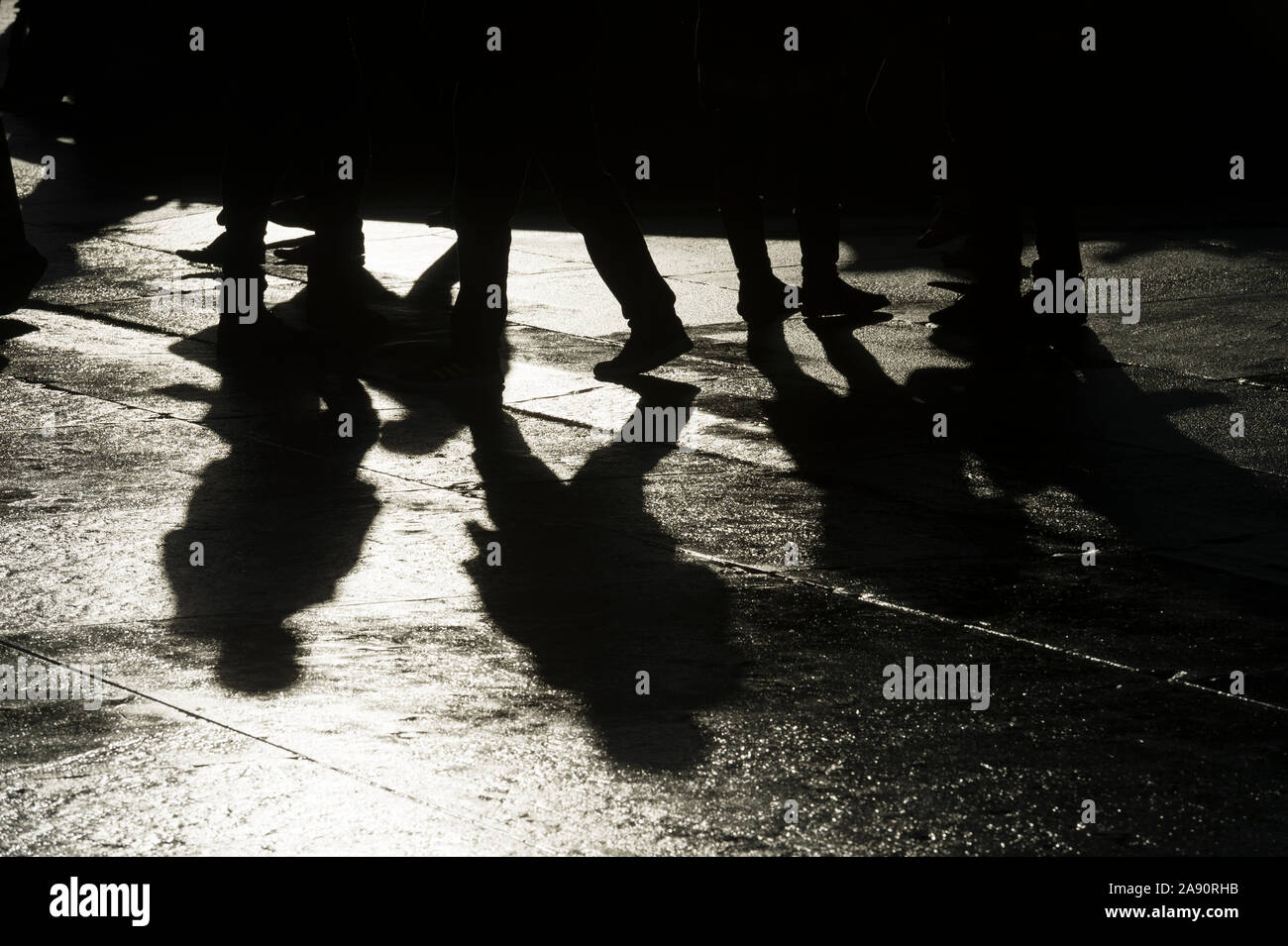 Shadows of people walking across Trafalgar Square, London, Britain ...