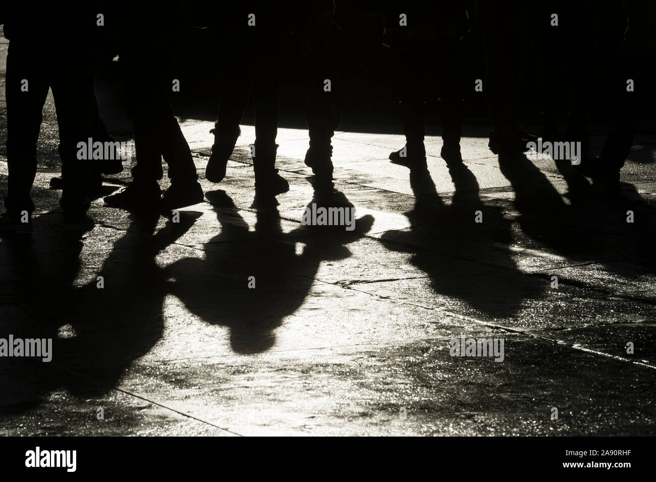 Shadows of people walking across Trafalgar Square, London, Britain ...