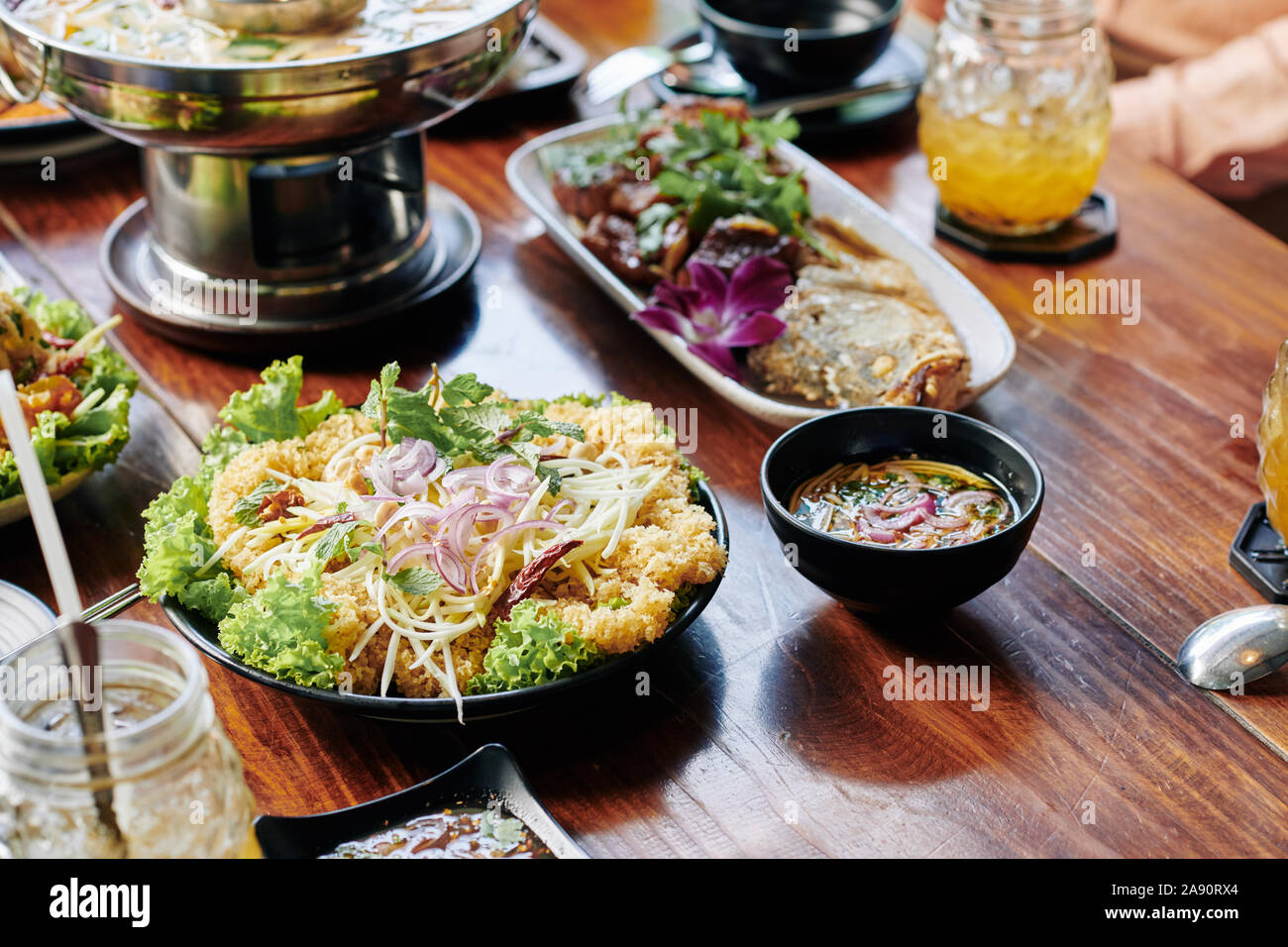 Japanese style deep fried shrimps, fish and soba noodles on wooden ...