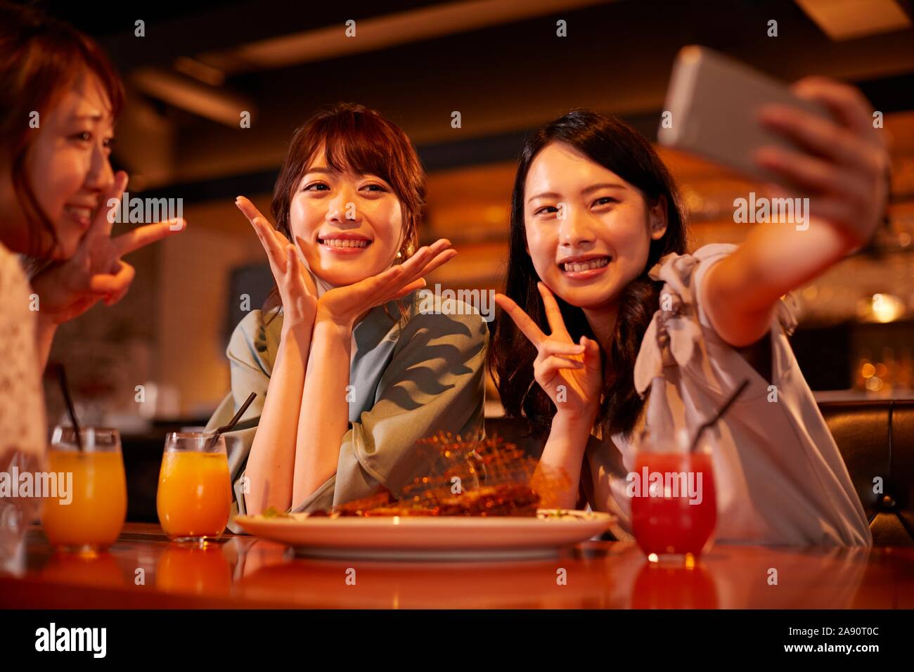 Young Japanese friends having fun together Stock Photo - Alamy