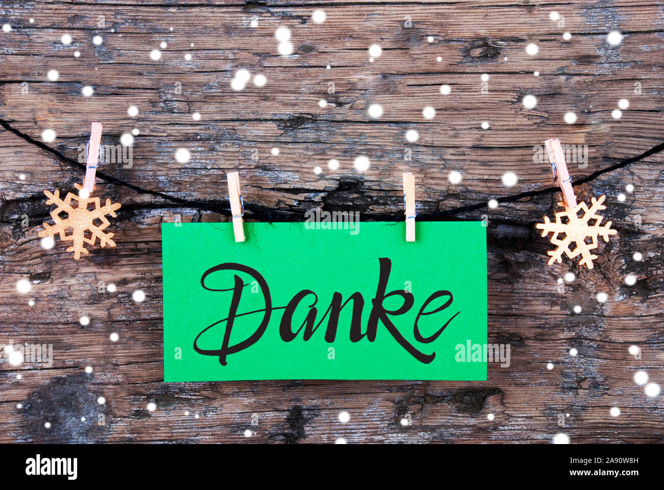 Green Label, Snowflakes, Rope, Danke Means Thank You Stock Photo - Alamy