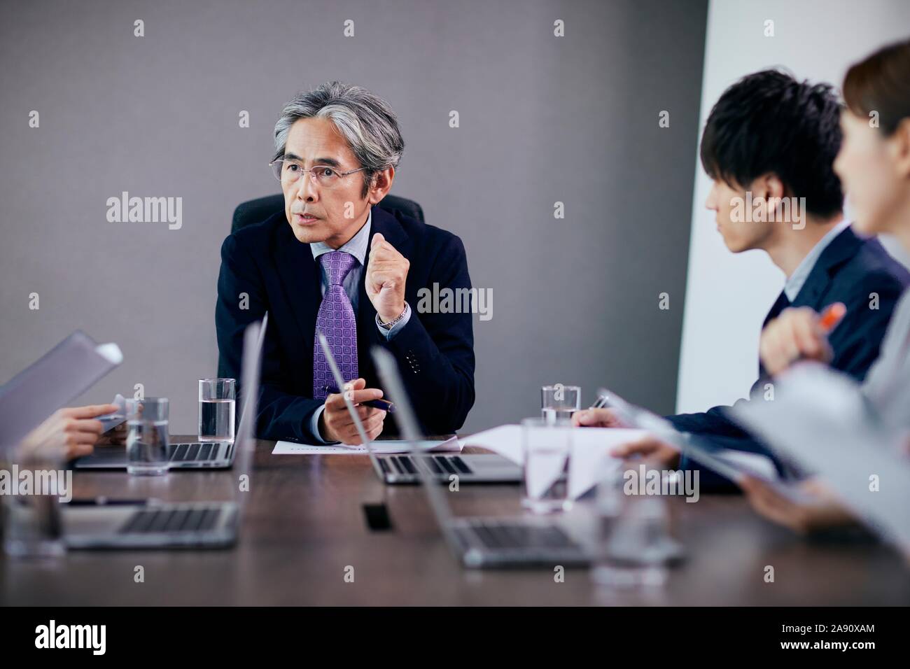 Japanese businesspeople having a meeting Stock Photo - Alamy