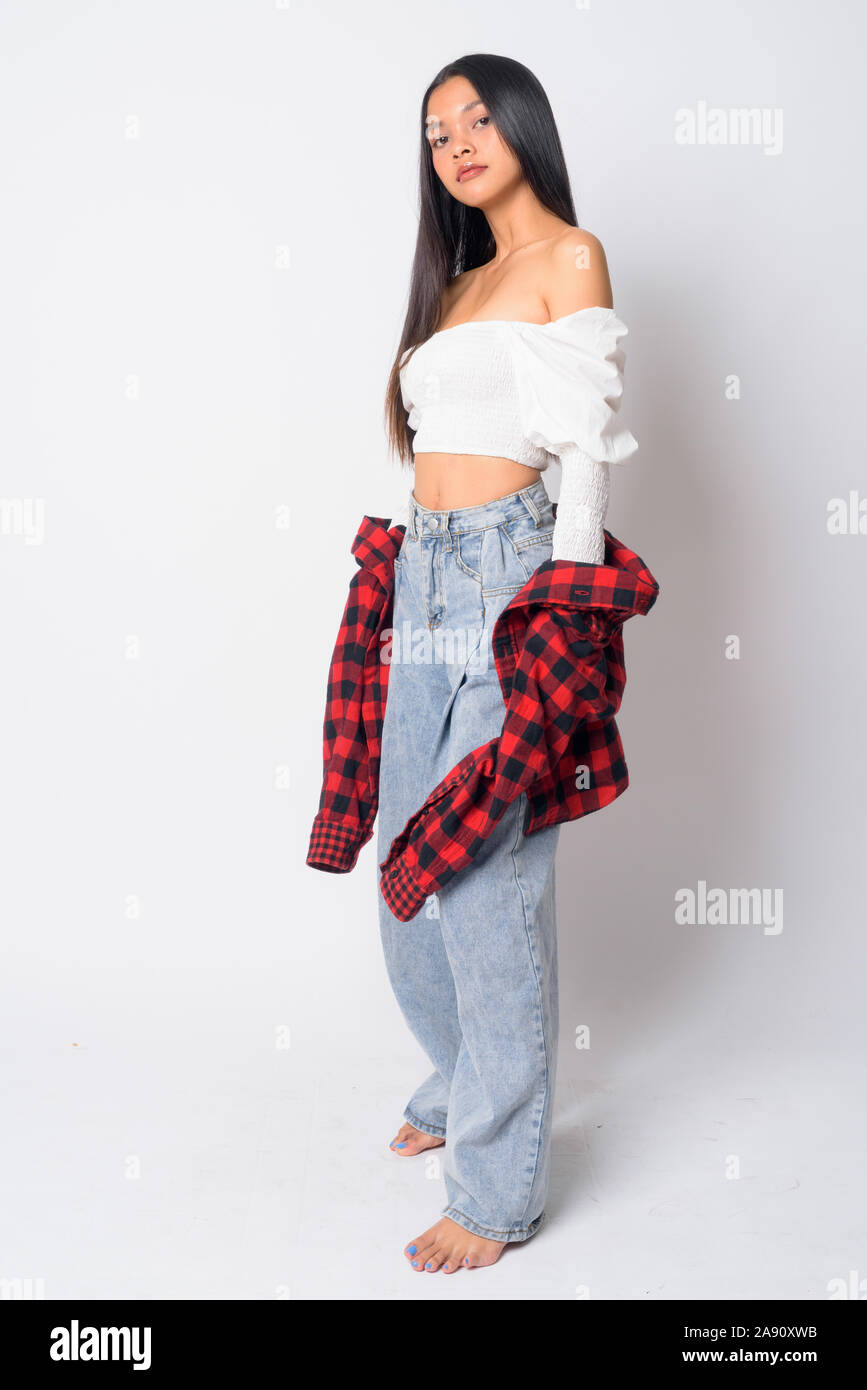 Full body shot of young beautiful Asian hipster woman Stock Photo - Alamy