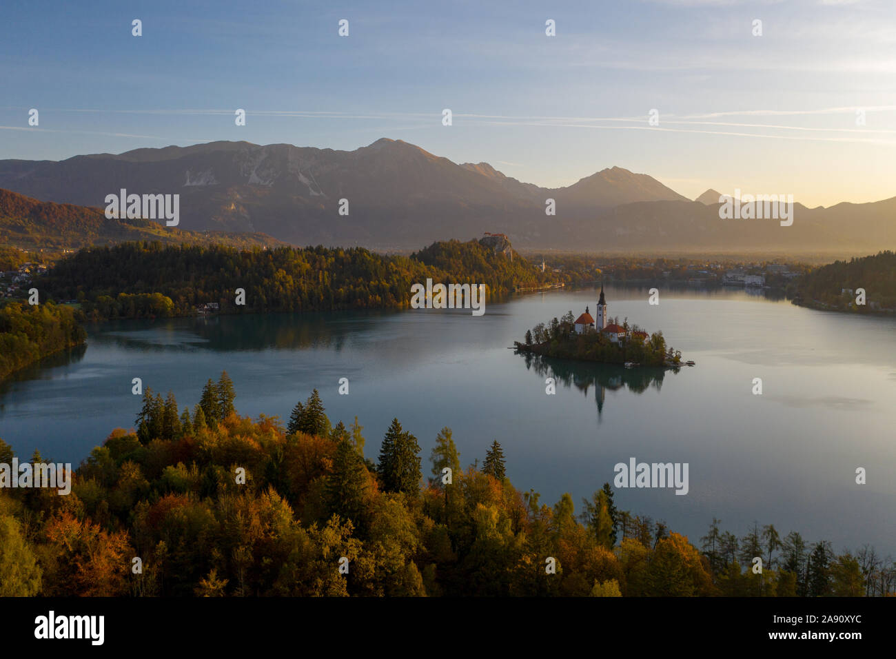 Aerial view of the colorful forest and Lake Bled with a small island ...