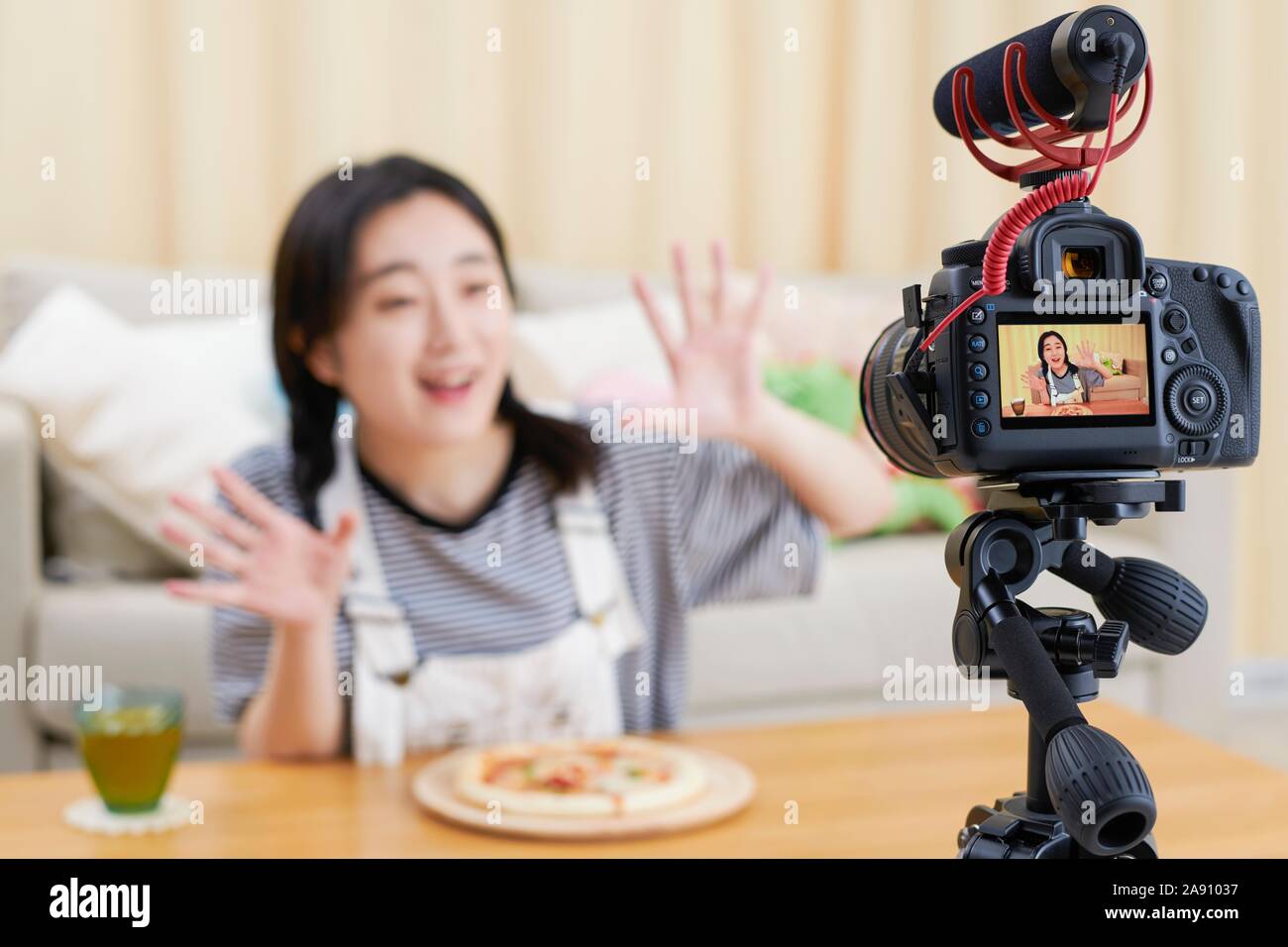 Young Japanese youtuber streaming at home Stock Photo - Alamy