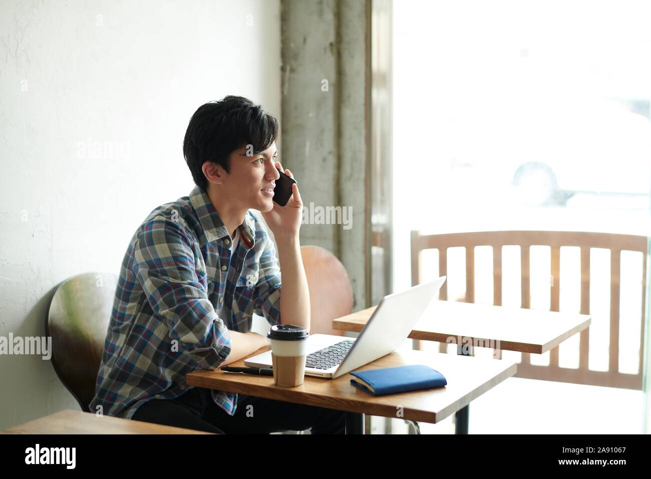 Young Japanese man at a cafe Stock Photo - Alamy