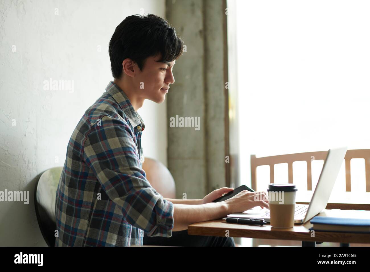 Young Japanese man at a cafe Stock Photo - Alamy