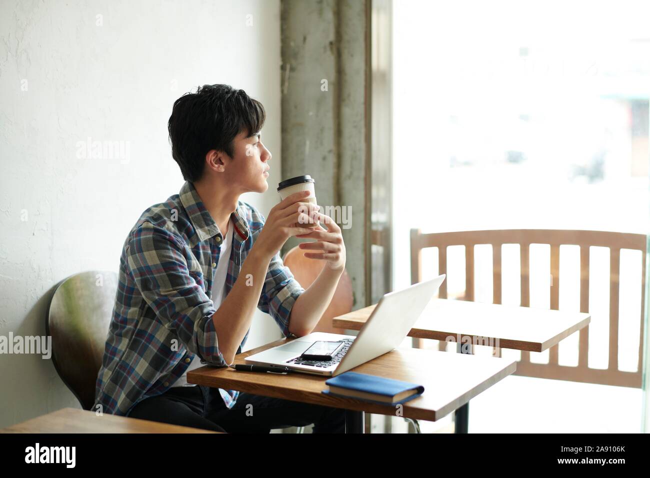 Young Japanese man at a cafe Stock Photo - Alamy