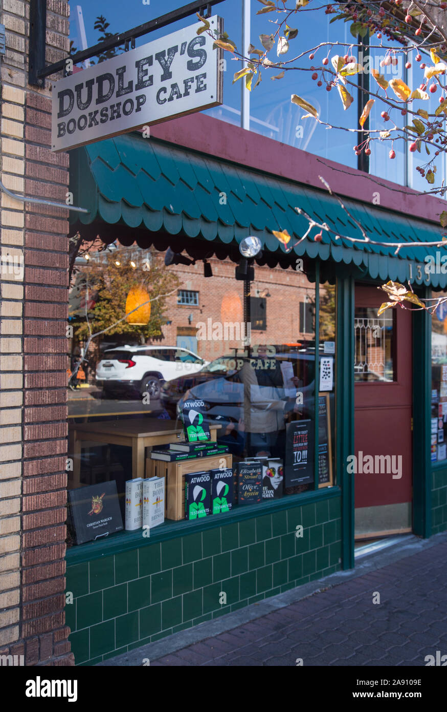 The storefront and street sign for Dudley's Bookshop Cafe, a charming ...